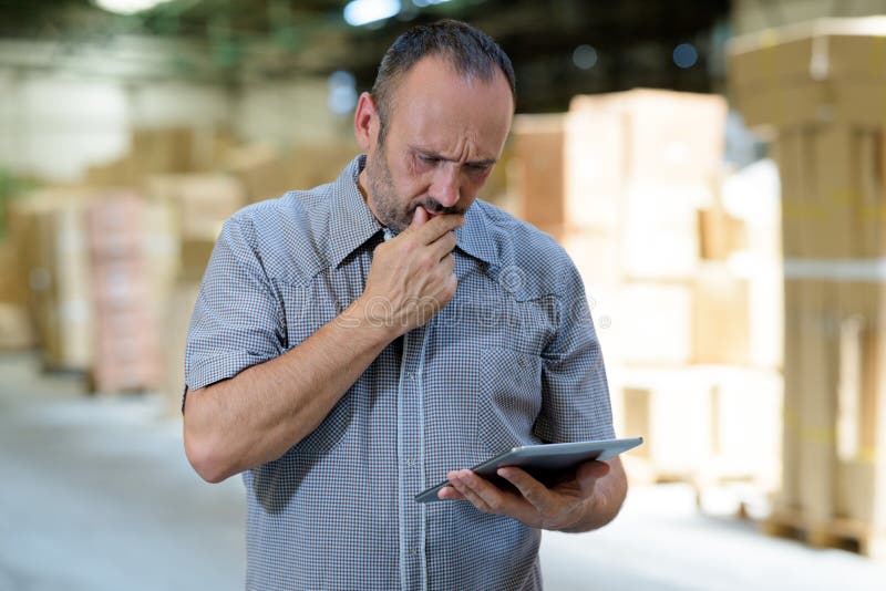 Men inspecting stack wood stock image. Image of tablet - 264199375