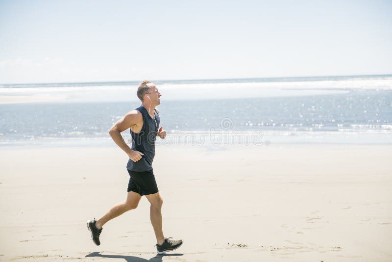A Men Jogging on Day Time on the Beach Stock Image - Image of clothing ...