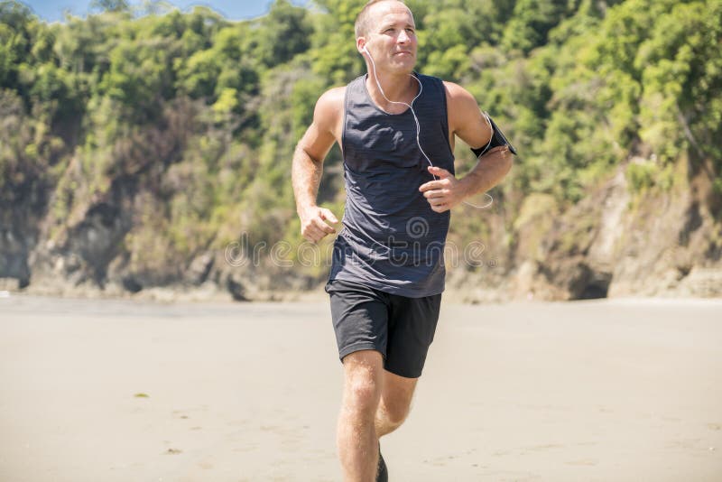 A Men Jogging on Day Time on the Beach Stock Image - Image of morning ...