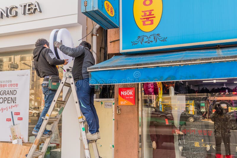 Installing Signage Stock Photos - Free & Royalty-Free Stock Photos from ...