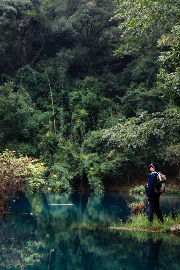 Men by lake stock photo. Image of water, blue, chinese - 12414988