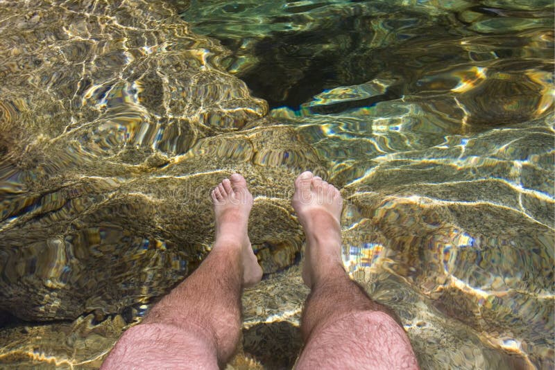 Men legs inside water stock photo. Image of legs, ocean - 2910370