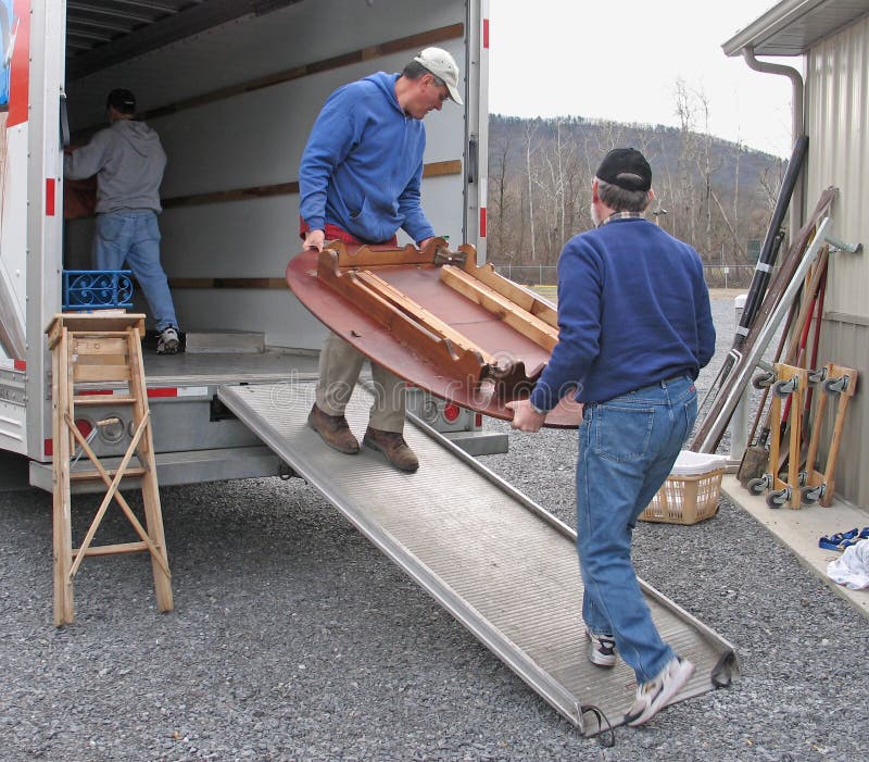 Men unload a moving van stock photo. Image of deliver - 1786714