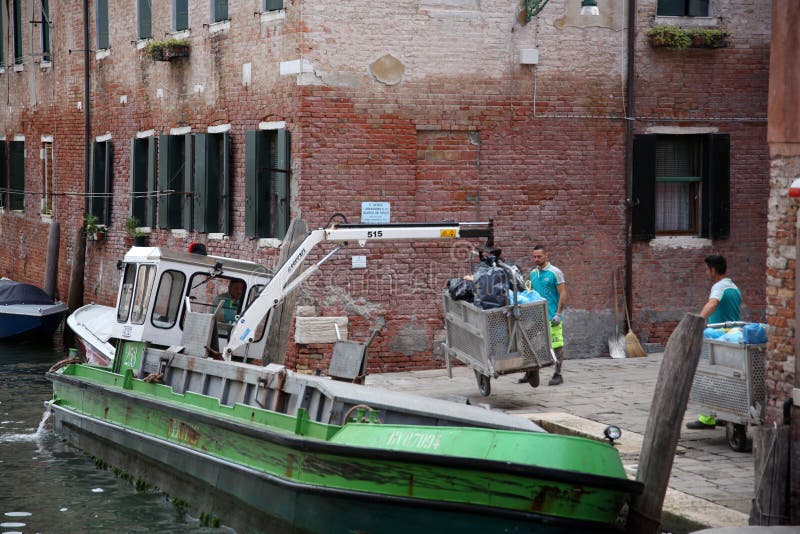 Garbage boat in Venice editorial stock photo. Image of venice - 55839213