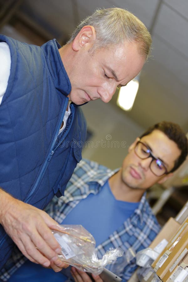 2 Men Looking for Item in Warehouse Stock Photo - Image of high ...