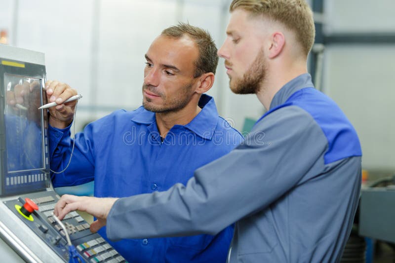 Men and machine operation stock image. Image of characteristic - 322654197