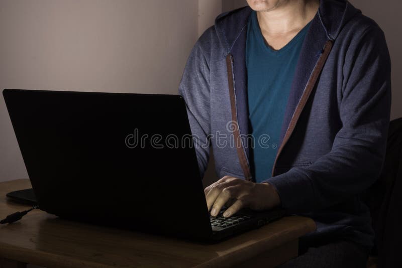 Men or Male Working or Playing Laptop Notebook Computer at Dark Stock ...