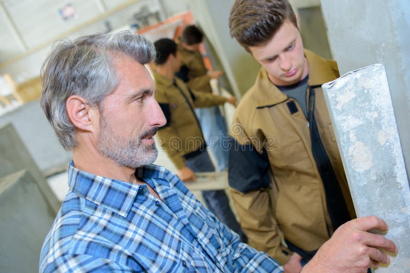 Men and masonry class stock image. Image of future, group - 222792709