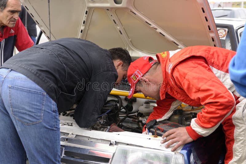Men Mechanics Checking an Engine of a Car at a Pit Lane. Kyiv, Ukraine ...
