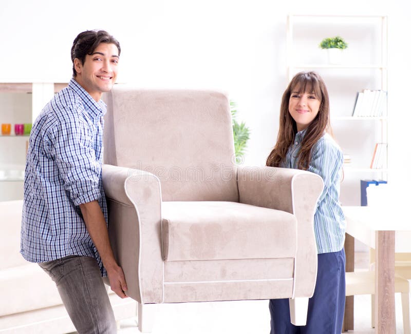 Man Moving Armchair in the Living Room Stock Image - Image of chair ...