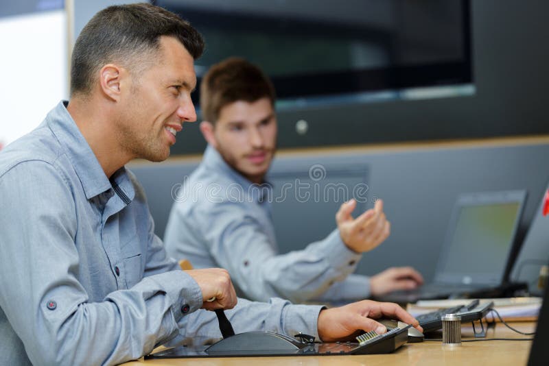 Men Operating Machinery with Lever Stock Image - Image of engineering ...