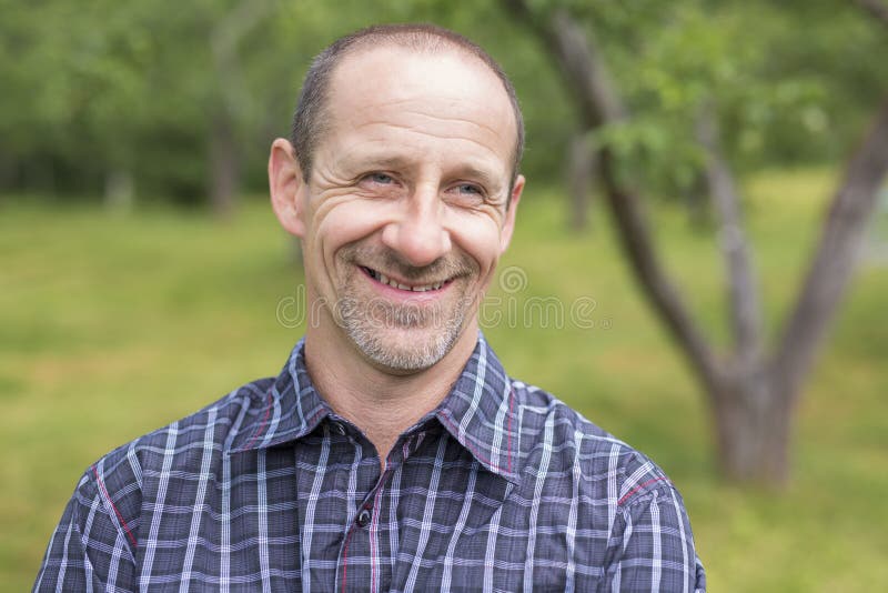 Men Outdoors Smiling Close To a Tree in the Forest Stock Image - Image ...