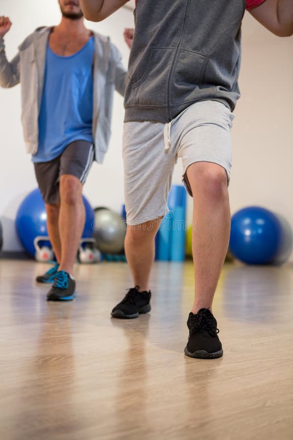 Men Performing Stretching Exercise Stock Photo - Image of health ...