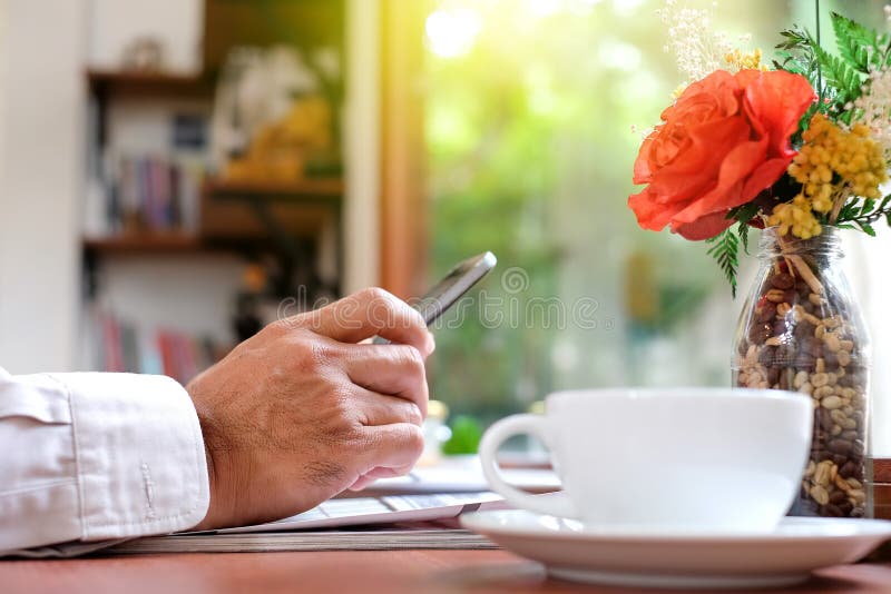 Men Play Smart Phones in Hand with Coffee Cup. Stock Photo - Image of ...