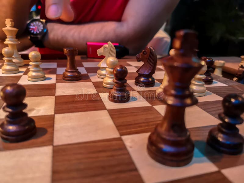 Men Playing Chess - King and Chess Pieces on a Wooden Board Stock Photo ...