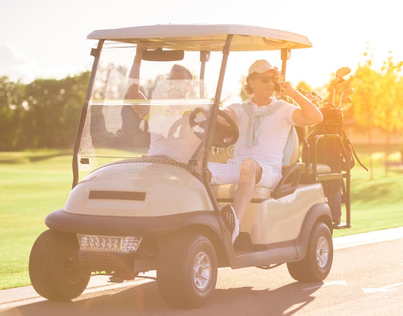 Men playing golf stock photo. Image of cart, drive, golf - 100038862