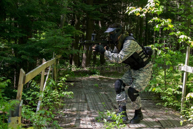 Paintball Player in the Forest Stock Photo - Image of targeting ...
