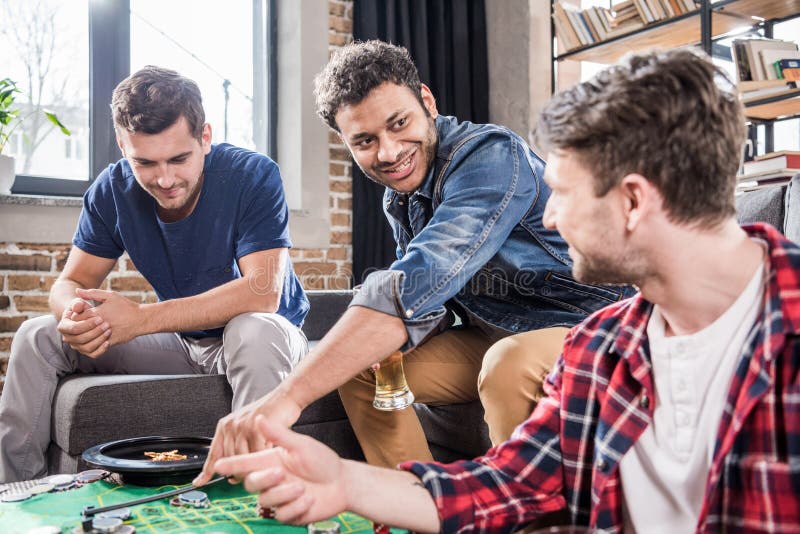 Men playing roulette game stock photo. Image of game - 93100224