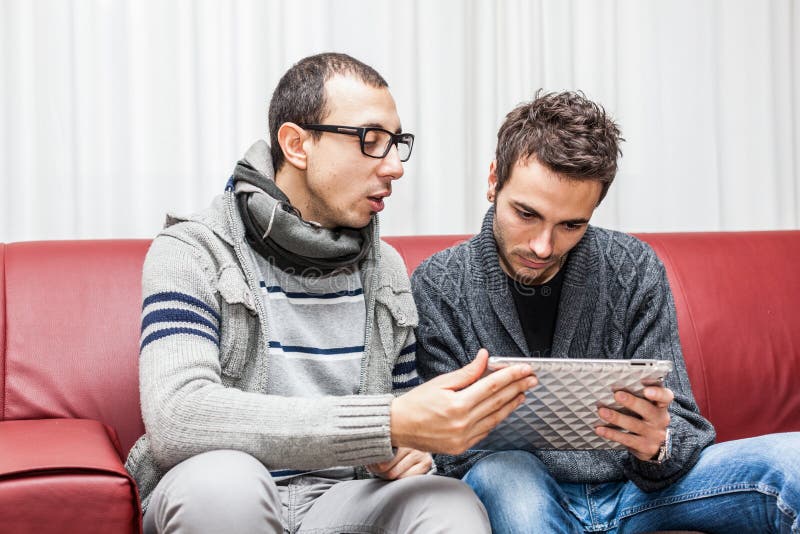 Men Playing with Tablet PC stock photo. Image of adult - 28076796