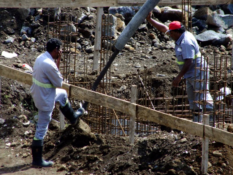Men Pouring Cement into Construction Foundation Editorial Stock Photo ...