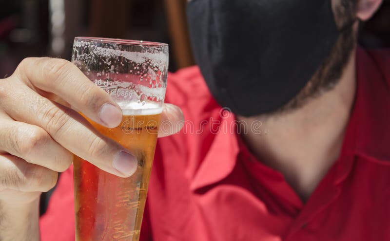 Men with Protective Face Mask Holding a Glass of Beer Stock Photo ...