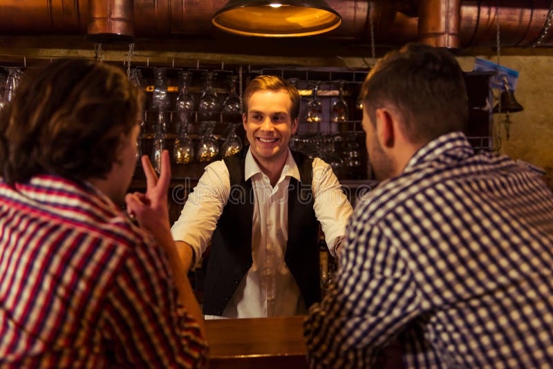 Men in pub stock image. Image of customers, looking, alcoholic - 67778463