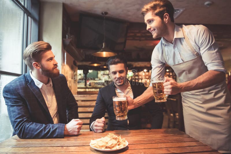Men at the pub stock image. Image of lifestyle, drink - 85654845