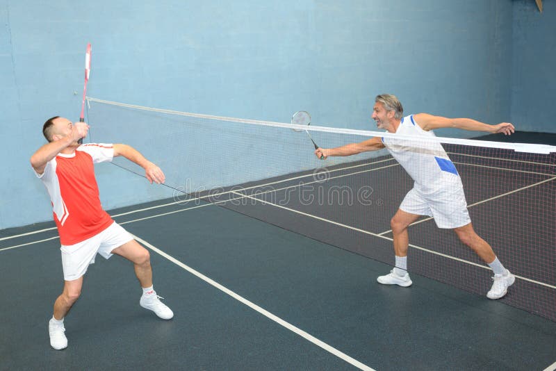 Men Reaching Out during Badminton Game Stock Image - Image of court ...