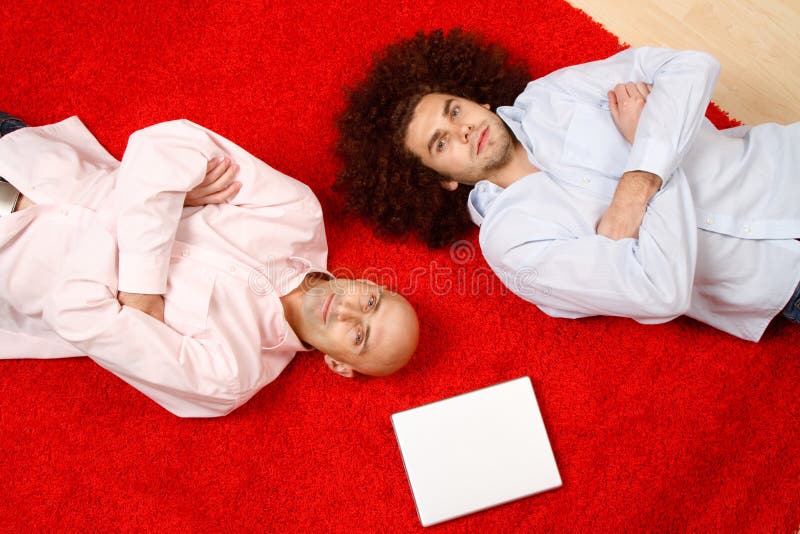 Men relaxing on rug stock photo. Image of leisure, inactivity - 17757702