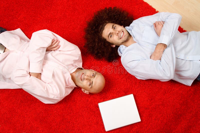 Men relaxing on rug stock image. Image of gaze, closeup - 17757787