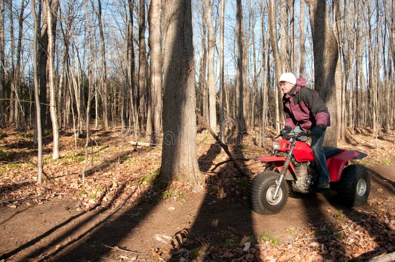 Men Riding a Four Wheel ATV Stock Photo - Image of wheels, active: 20711862