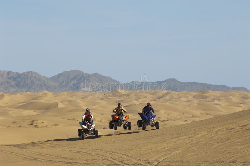 Men Riding Quad Bikes in Desert Stock Image - Image of copyspace ...