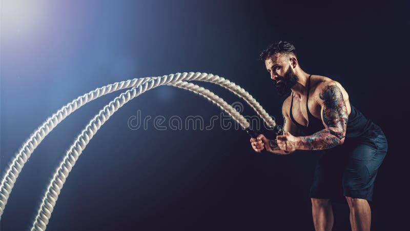 Men with Rope in Functional Training. Studio Shot, Isolate Stock Photo ...