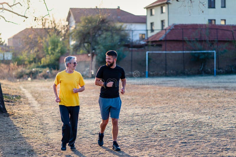 Men running in the park stock image. Image of runners - 136583027