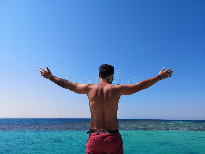 Men`s Back Against the Backdrop of a Water Plexus of the Sea, Relax and ...