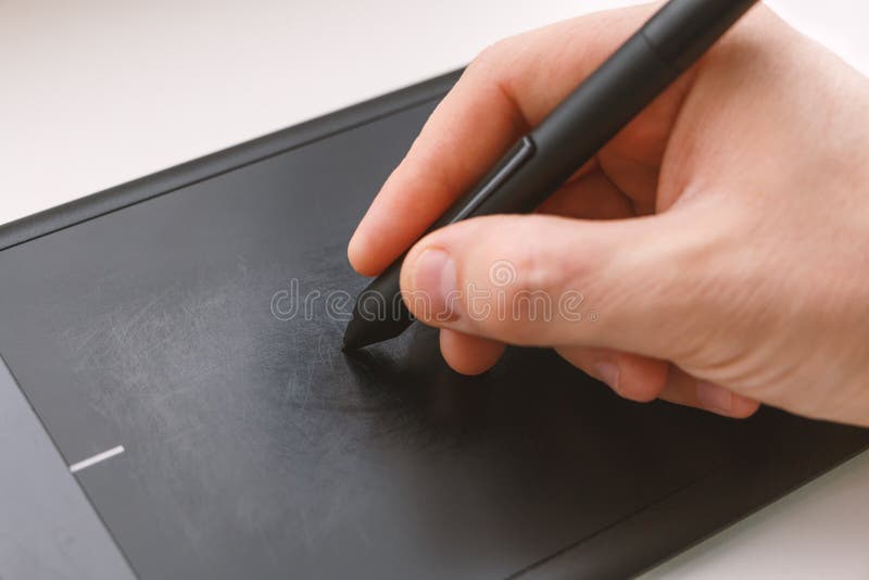 Men`s Hand Draws on a Graphics Tablet Using a Stylus Stock Photo ...