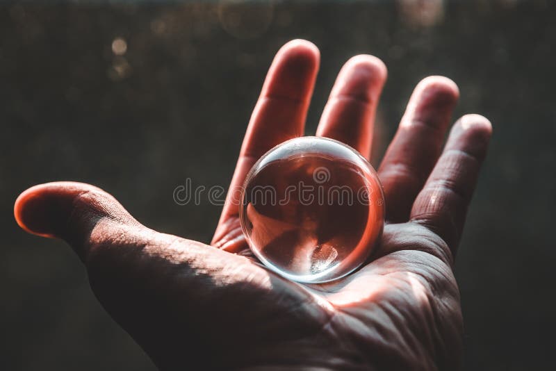 Men S Hand Holding a Small Glass Purchase in the Palm of His Hand ...