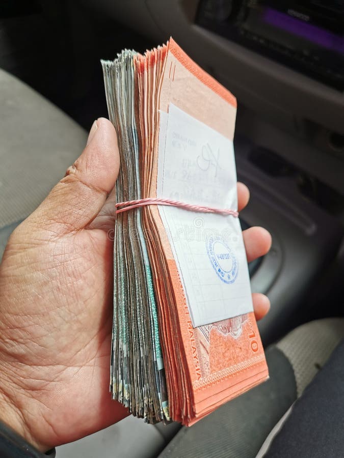 Men S Hand Holds a Bundle of Bank Notes. Stock Photo - Image of cash ...