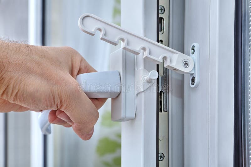 Men`s Hand Opens a Plastic Window with Stop Turning. Stock Photo ...
