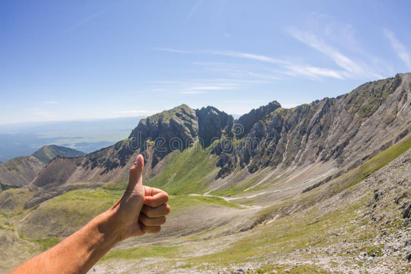 Men`s Hand Pointing His Finger Up Against the Mountain Peaks Stock ...