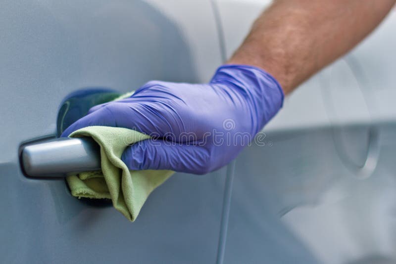 Men`s Hand in Protective Gloves Cleaning Car Door Handle Using ...