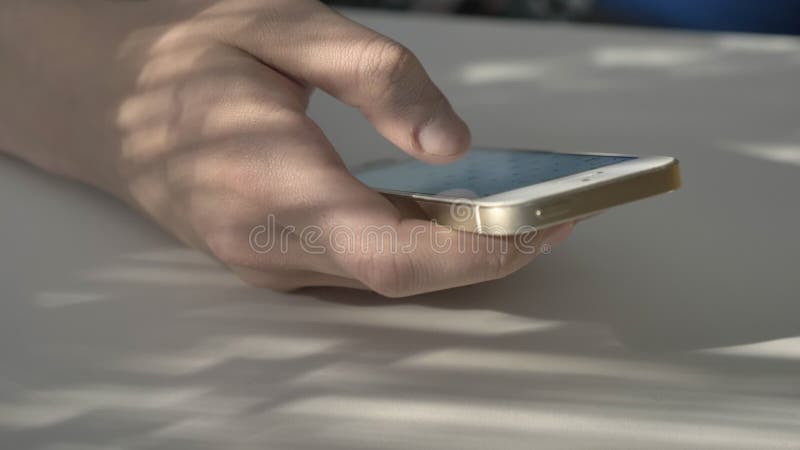 Men`s Hand Scrolling Calendar on a White Smartphone, Typing, Sunlight ...