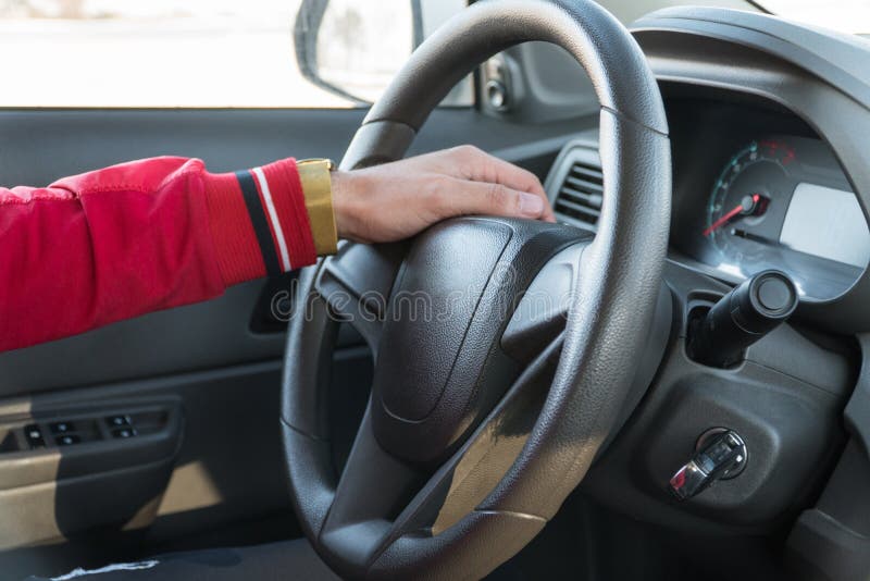 Hand on the steering wheel stock photo. Image of dashboard - 137635700