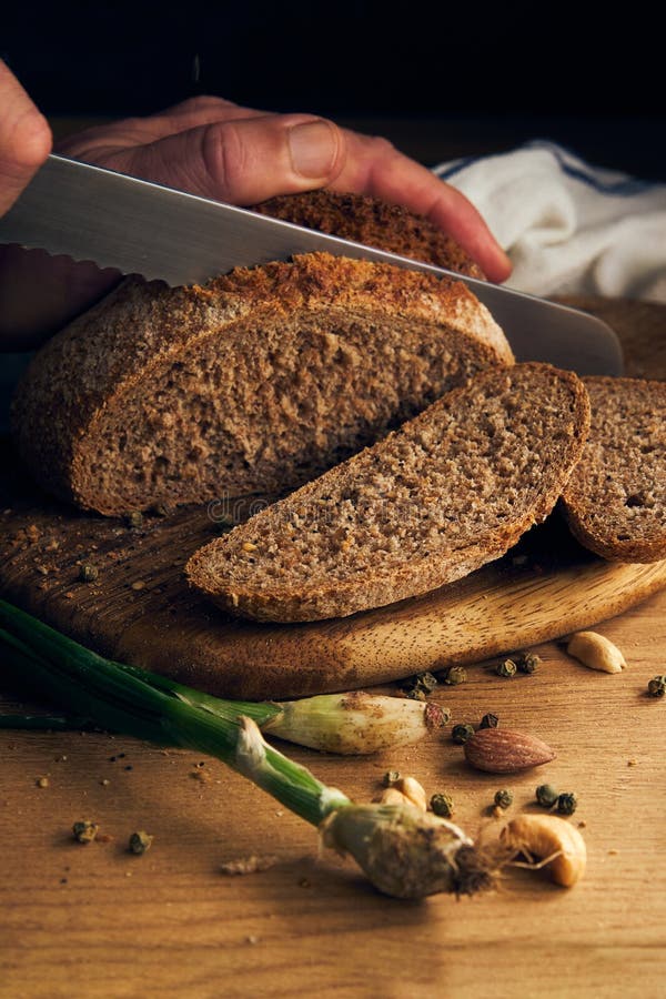 Men& X27;s Hands Cut Bread with a Knife Stock Image - Image of cooking ...