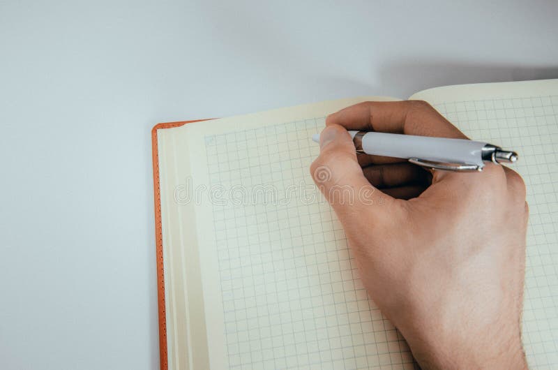 Men`s Hands, Forearm Hold a Pen, Notebook, Smartphone. Hands Write in ...