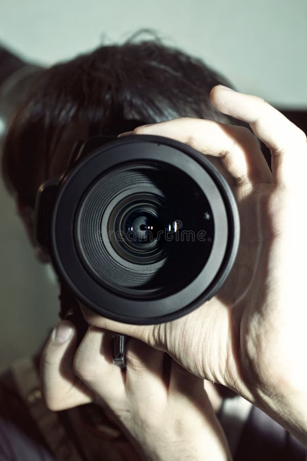 Men s hands held camera stock photo. Image of hand, face - 25738342