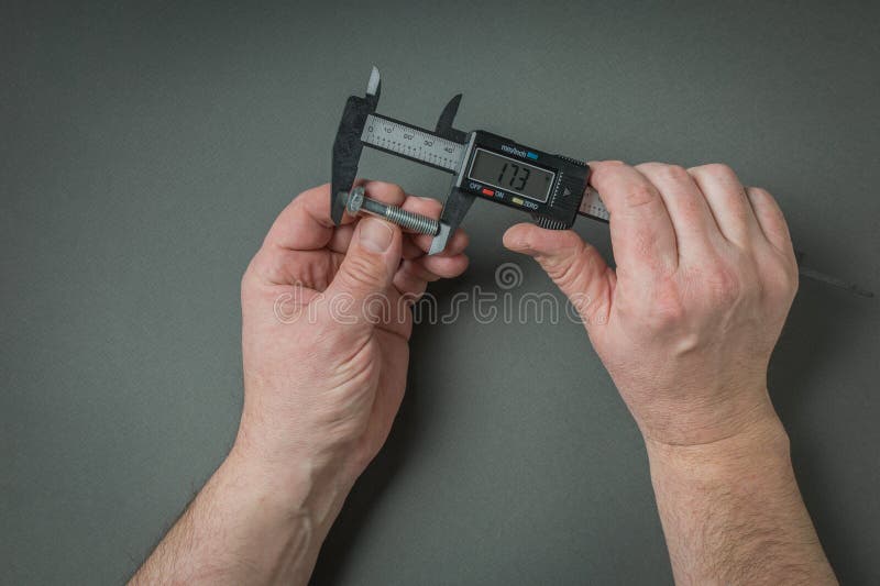 Men S Hands Measure the Using an Electronic Caliper Stock Photo - Image ...