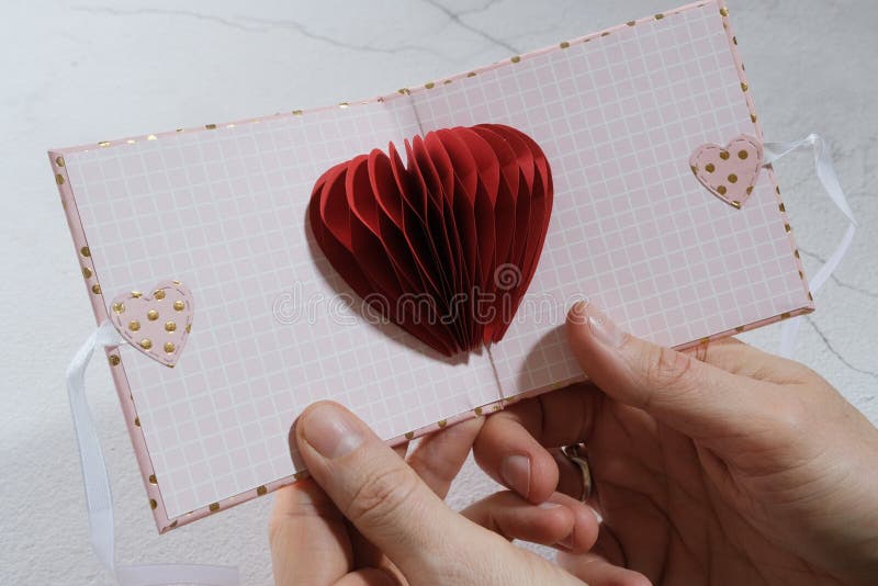 Men S Hands Open a Card Made by Hands with a Voluminous Red Heart ...