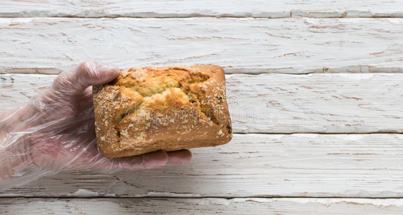 Men`s Hands in Protective Gloves Hold a Loaf of Bread Stock Image ...