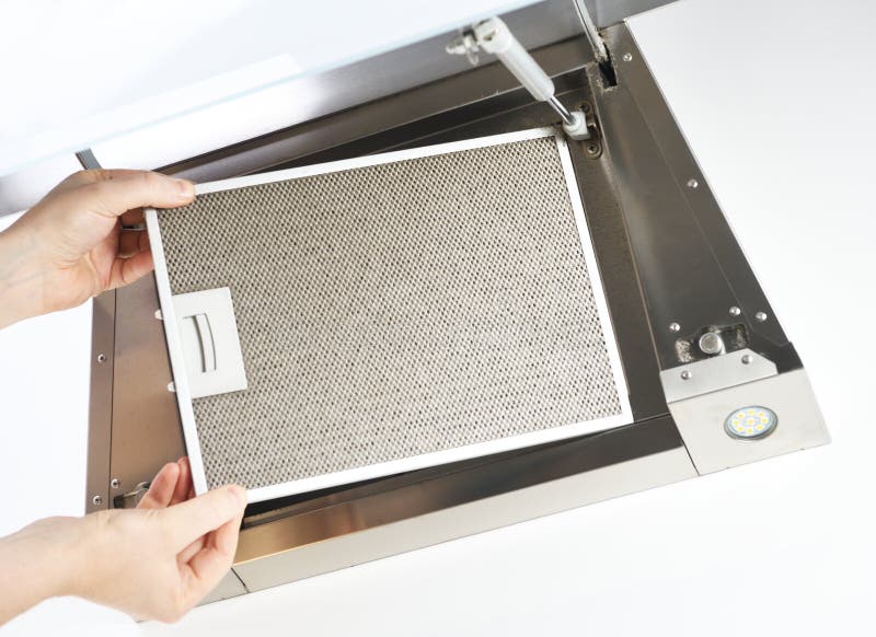 Men`s Hands Remove the Grease Filter from the Kitchen Hood.Remove the ...